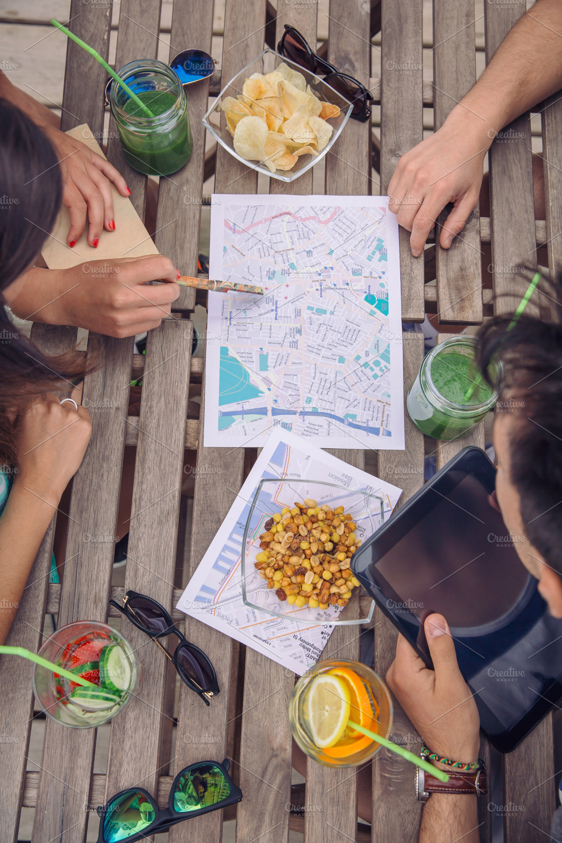 Young tourist friends looking maps, a Technology Photo by davidpereiras ...