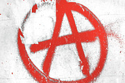 Red anarchy symbol, an Abstract Photo by KYNA STUDIO