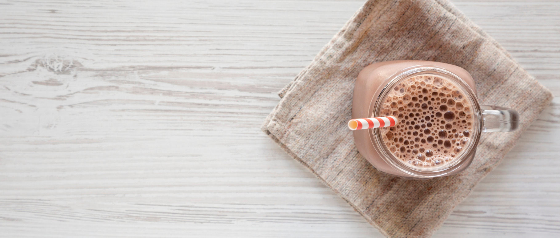 Homemade New England Chocolate Milkshake in a Glass Jar Mug on a, a ...