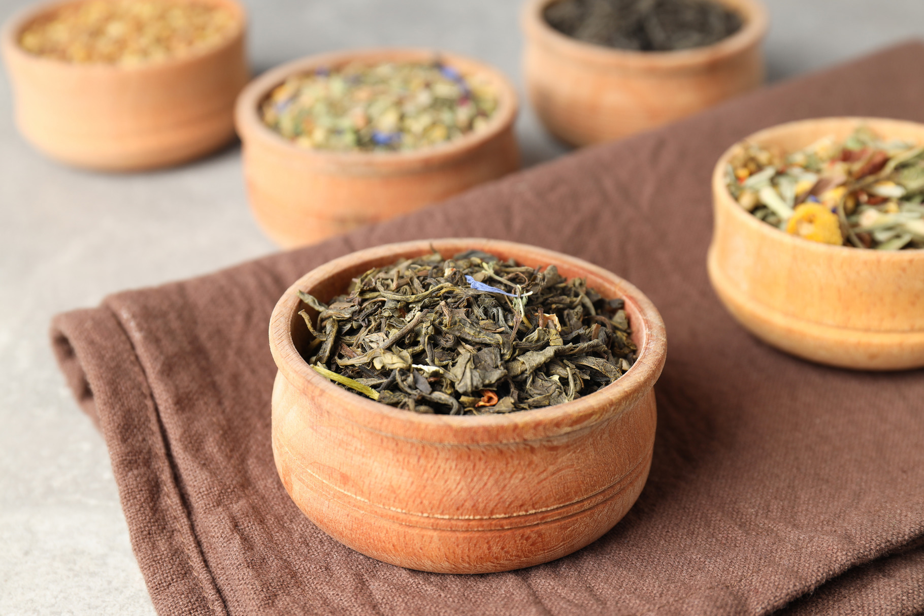 Concept of cooking tea with different types of tea on light text, a ...