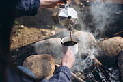 Hands pours itself hot beverage., a Food & Drink Photo by Yura_Yarema