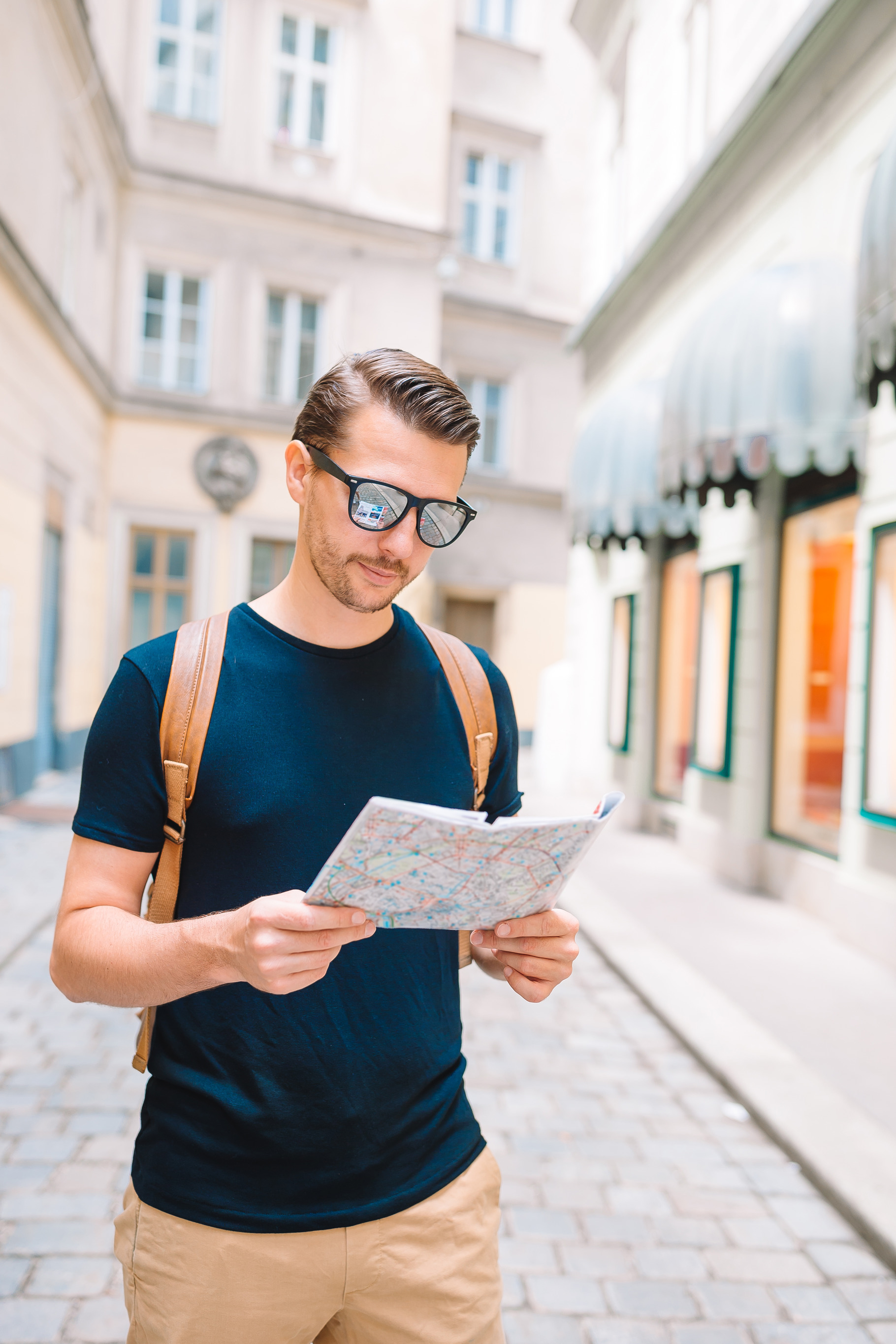 Man tourist with a city map and back featuring vacation, tourist, and ...