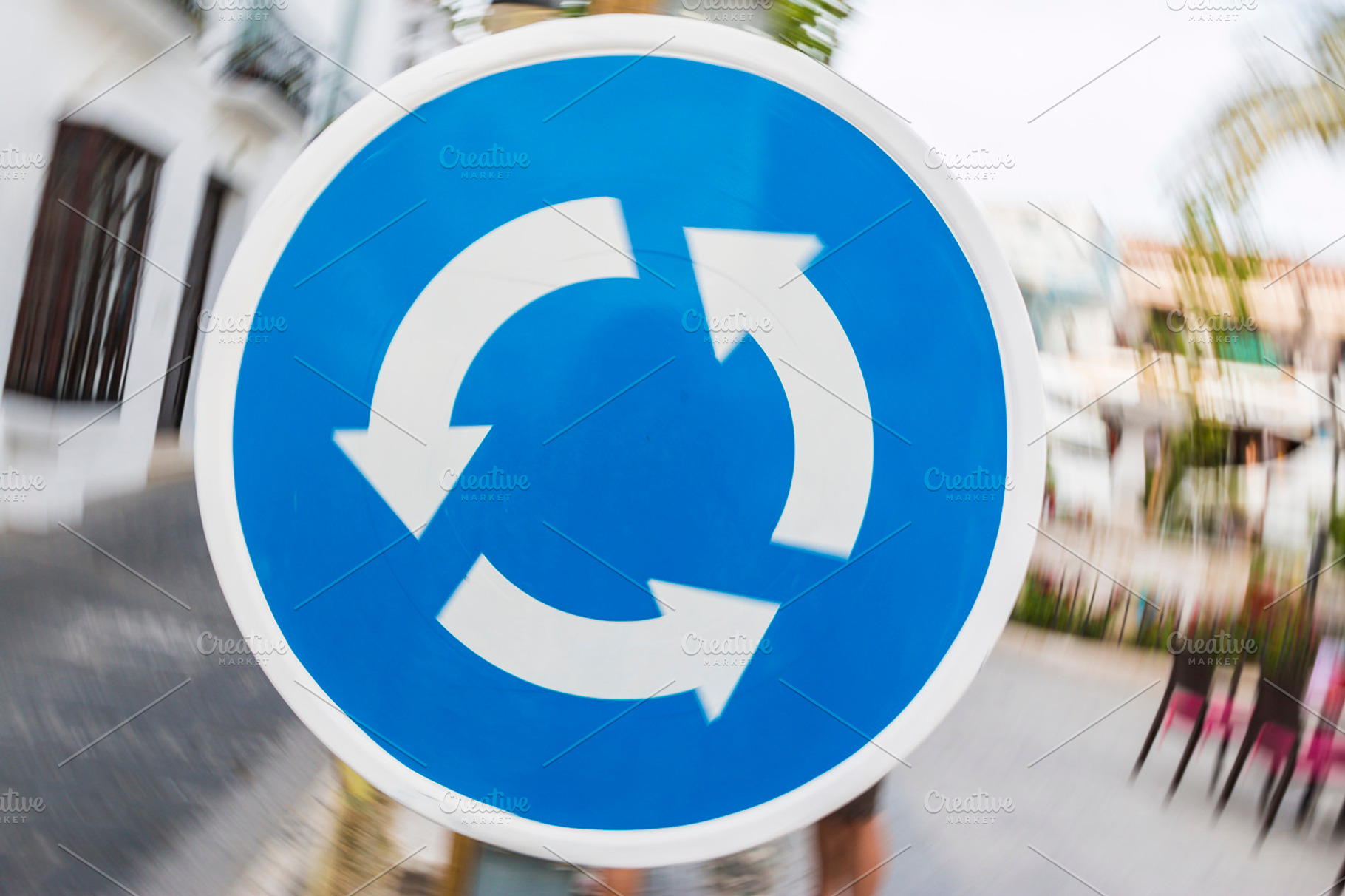 Roundabout sign motion, an Abstract Photo by Aitormmshop | Creative Market