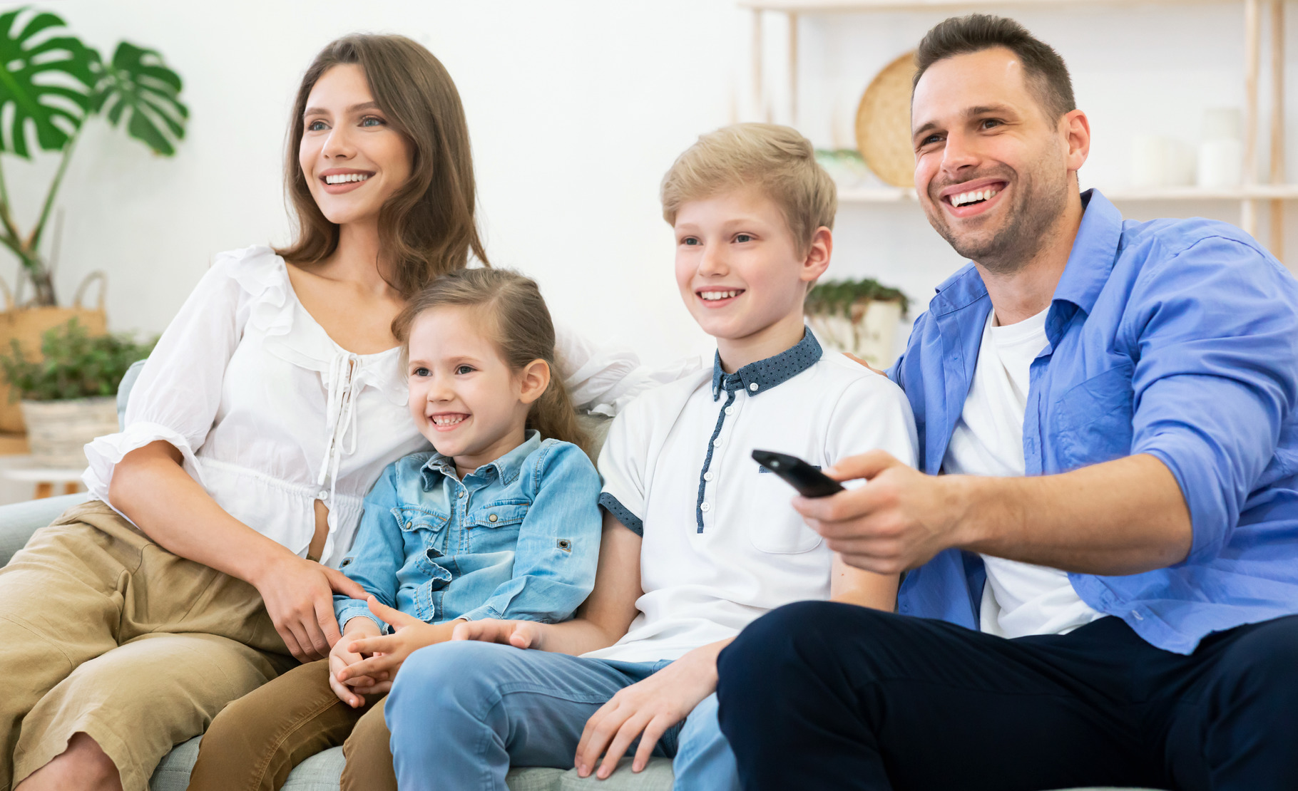 Happy Parents And Kids Watching TV T, a Background Photo by Prostock ...