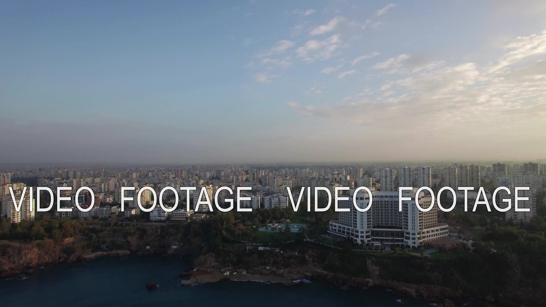 Aerial scene of built-up city with, a Graphic by Grey Coast Media