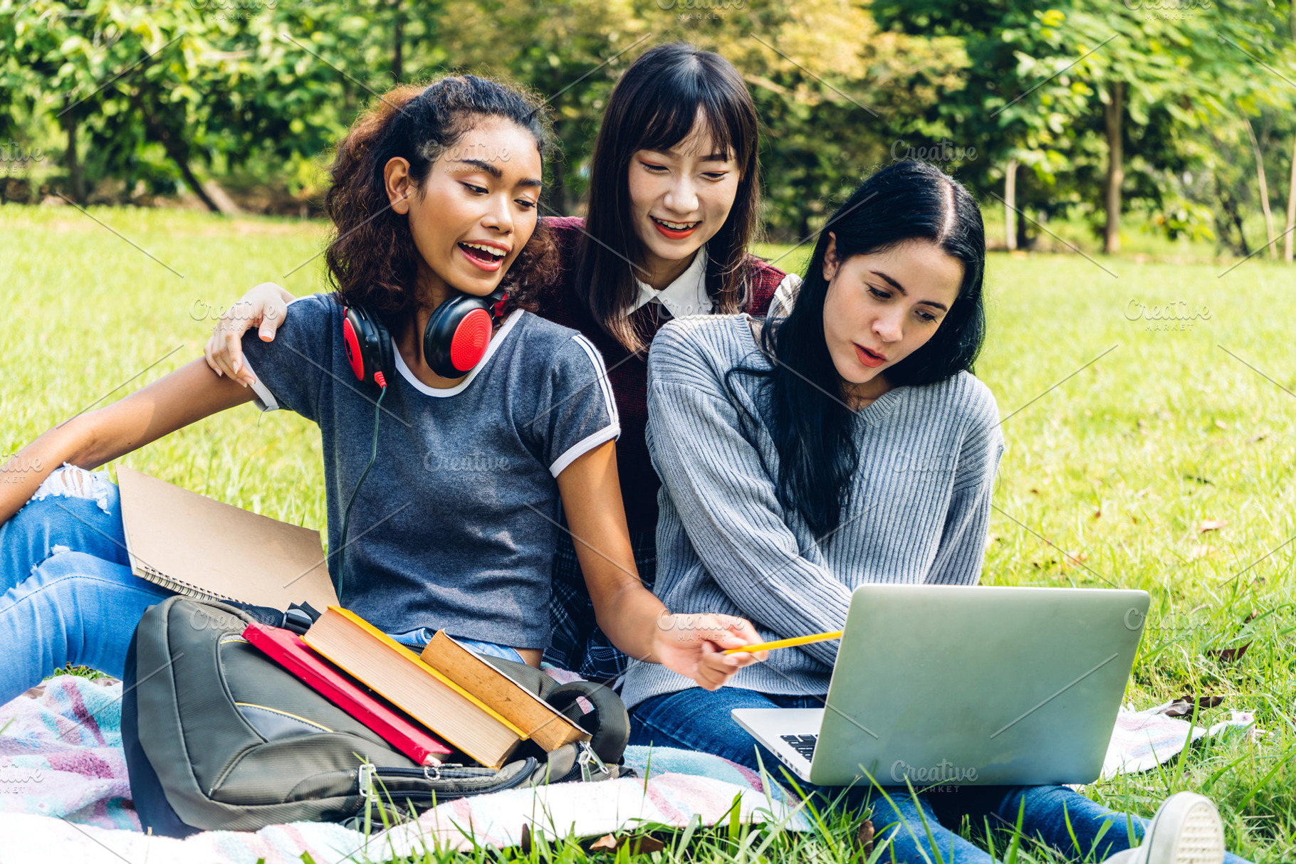 Group of smiling international students or teenagers sitting and, a ...
