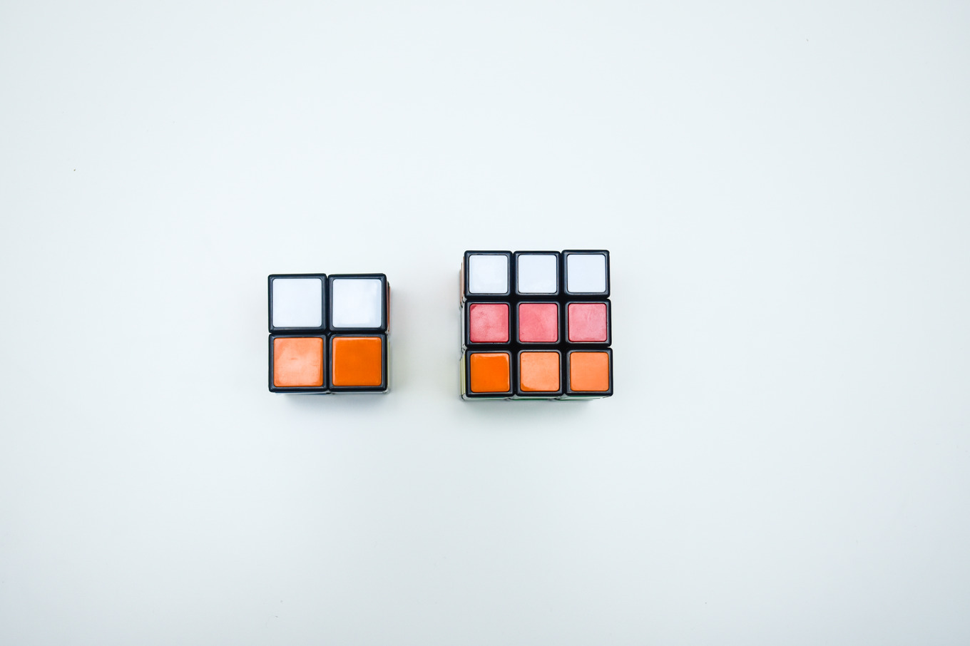 Colorful cubes containing construction tool, cubes, and rubiks cube, an ...