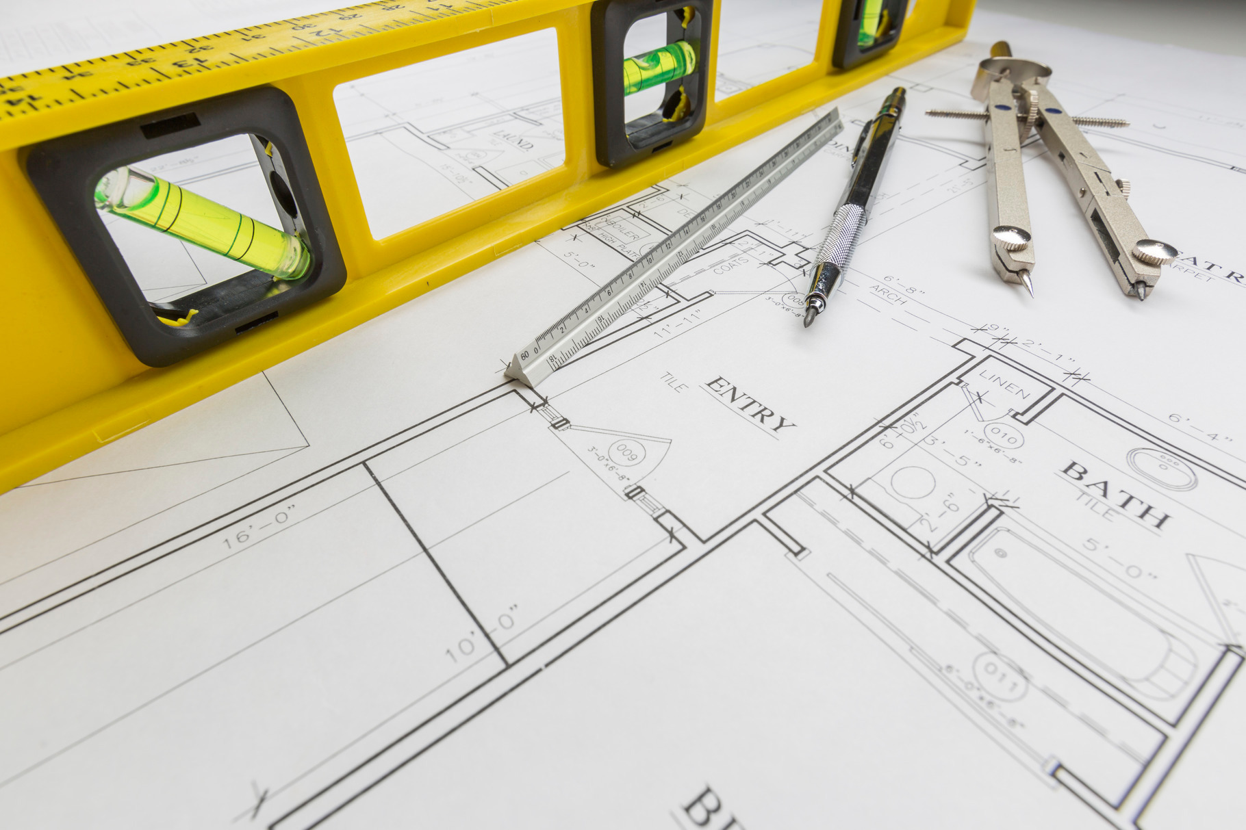 Drafting tools resting on plans featuring architect, architectural, and ...