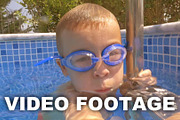 Child diving in the pool, a Sports & Recreation Photo by Grey Coast Media