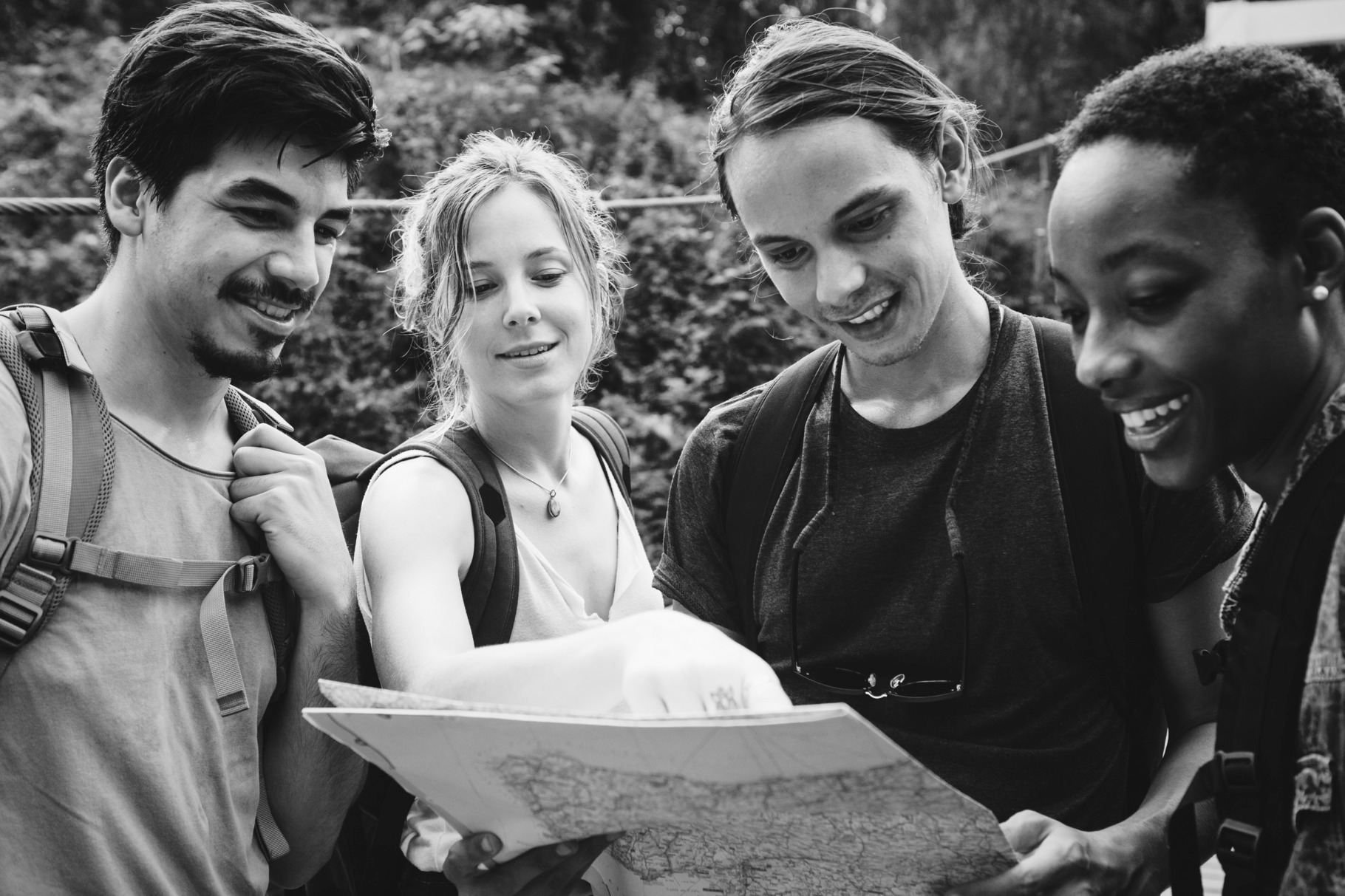 Friends finding a way out with map | Stock Photos ~ Creative Market