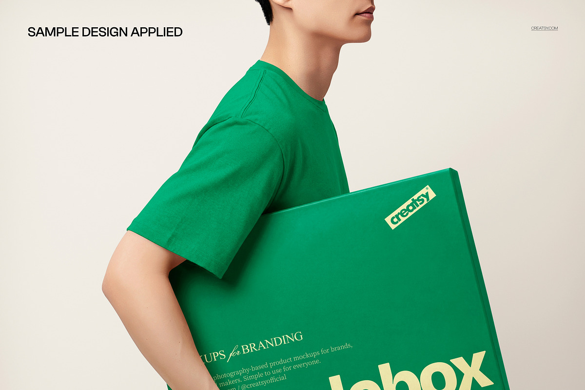 Man Holding Packaging Box Mockup, a Packaging Mockup by creatsy5