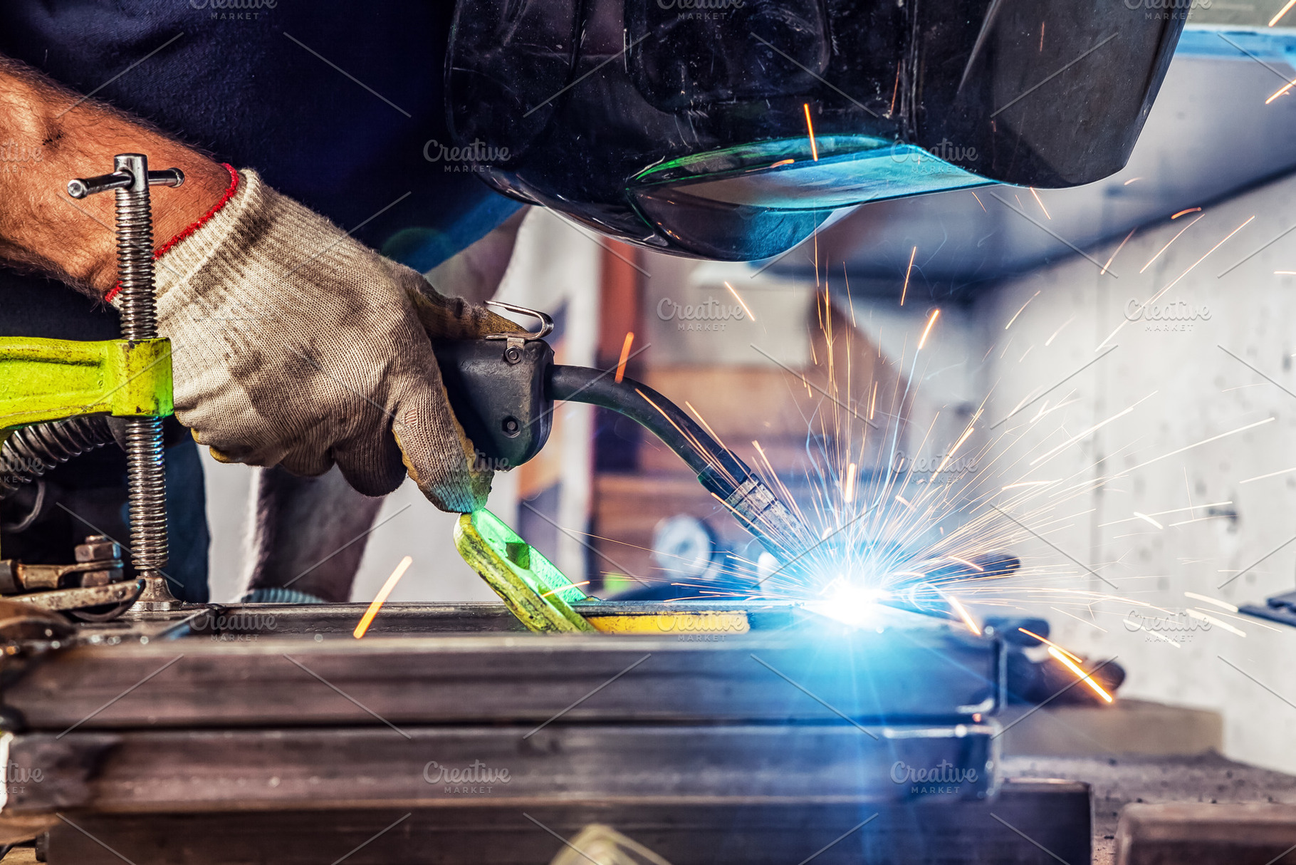 A strong man welder featuring background, blade, and builder, an ...