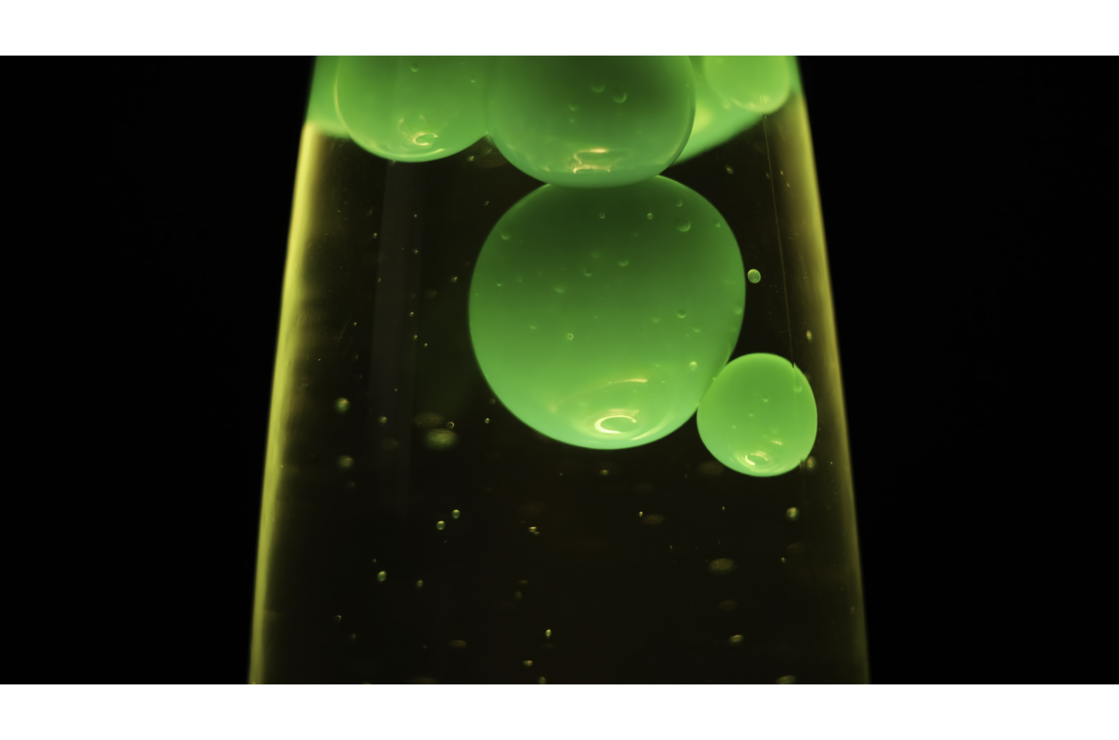 Close up view of green lava lamp, a Wallpaper Graphic by Media Whale Stock
