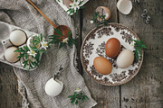 Easter rustic still life. Natural easter eggs, blooming spring f ...