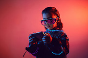 portrait cyberpunk boy child in neon glasses in blue and red tones with ...