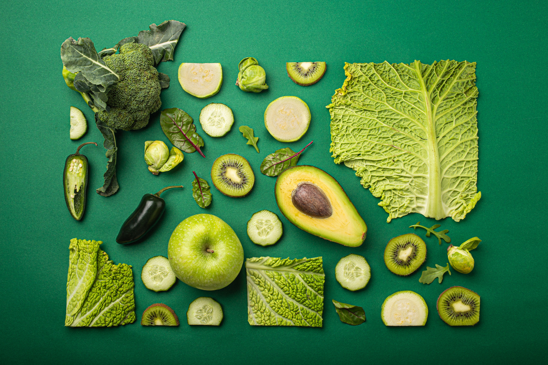 Creative layout food concept made of green fruit and vegetables, a ...