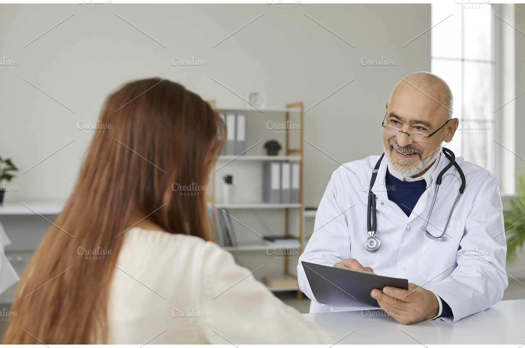 Smiling old doctor consult woman, a Health & Medical Photo by ...