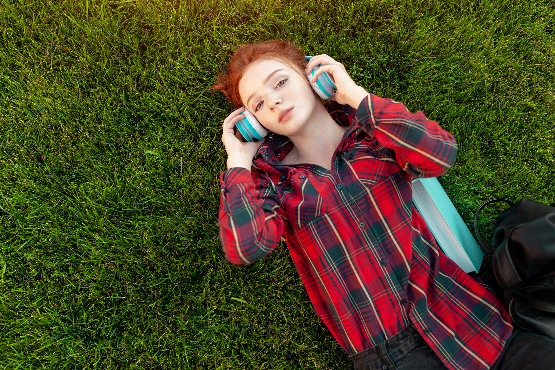 Beautiful young redhaired student g featuring student, lies, and grass ...