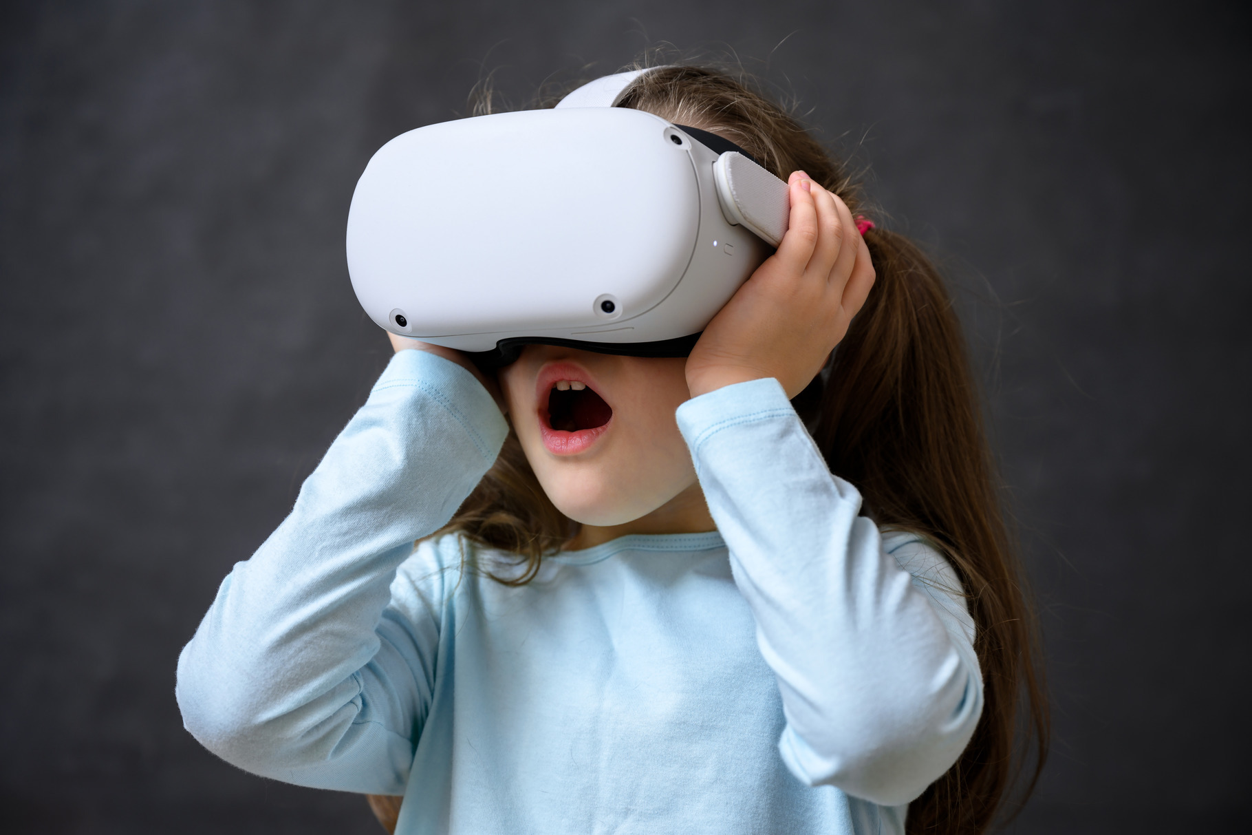 Kid using virtual reality headset | People Images ~ Creative Market
