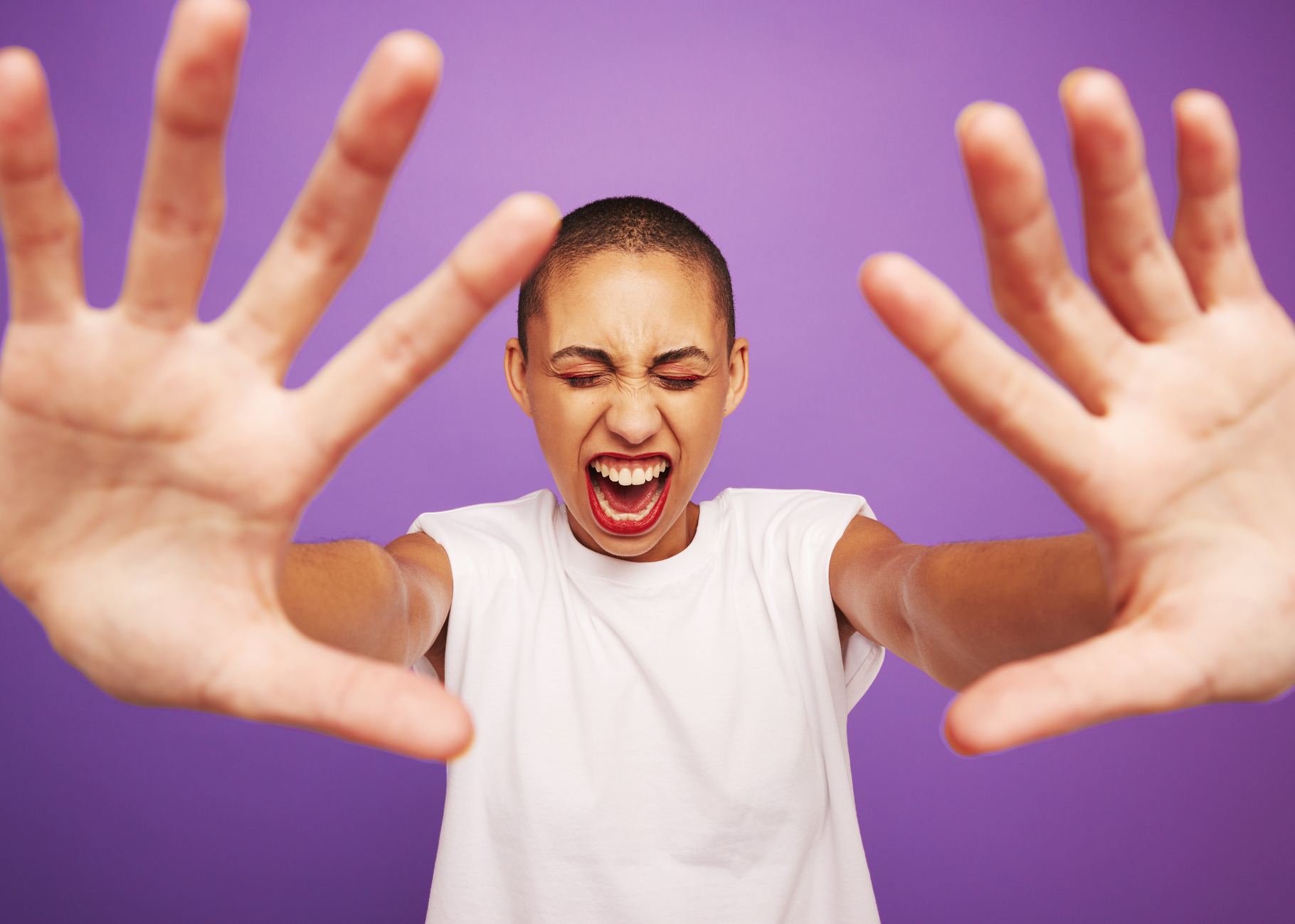 Excited woman screaming on purple background, a Person Photo by Jacob Lund