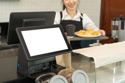 Woman barista people in apron working on POS system machine with, a ...