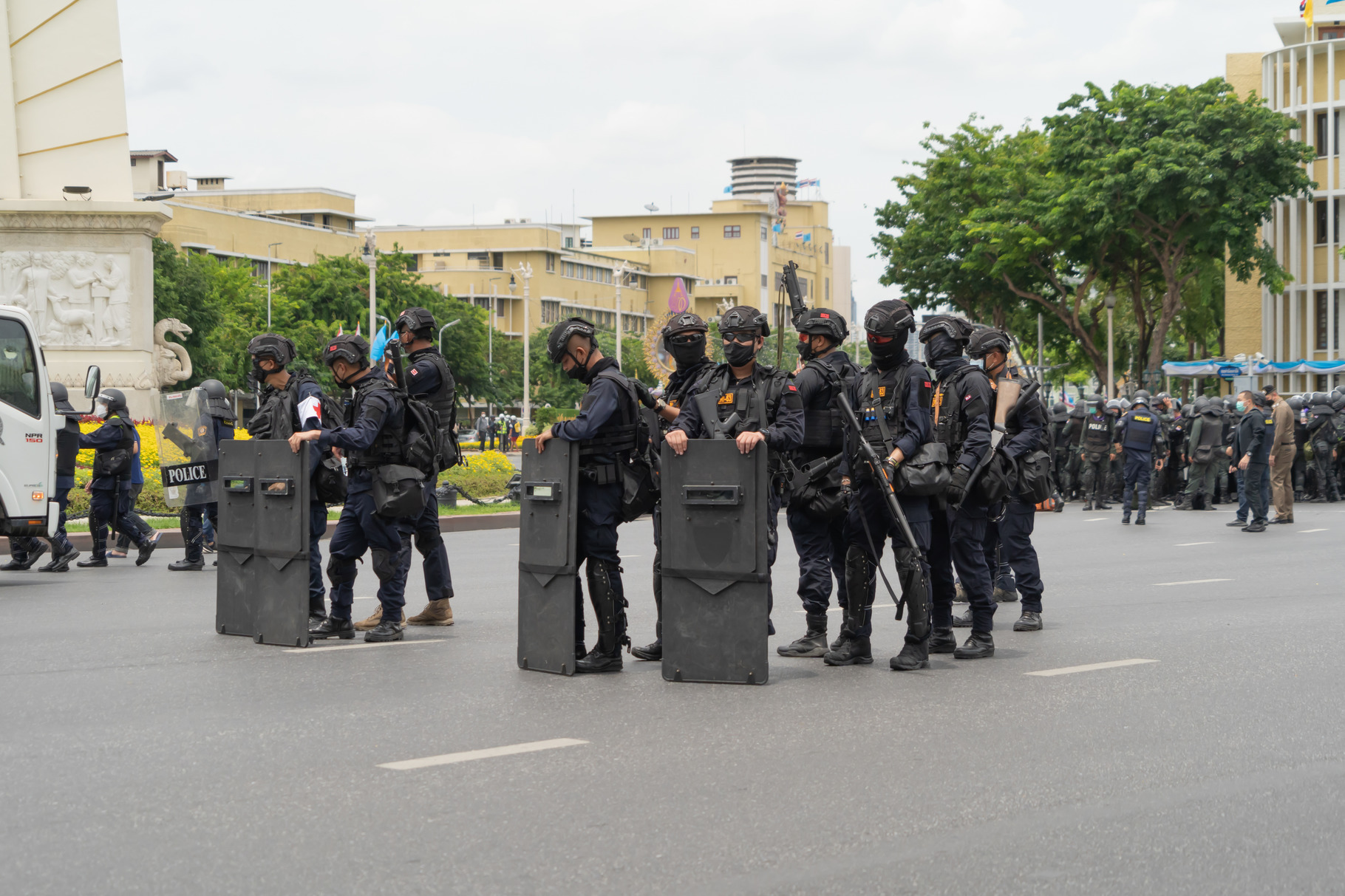 Police officer team with weapons and riot shield protection. Vio, a ...