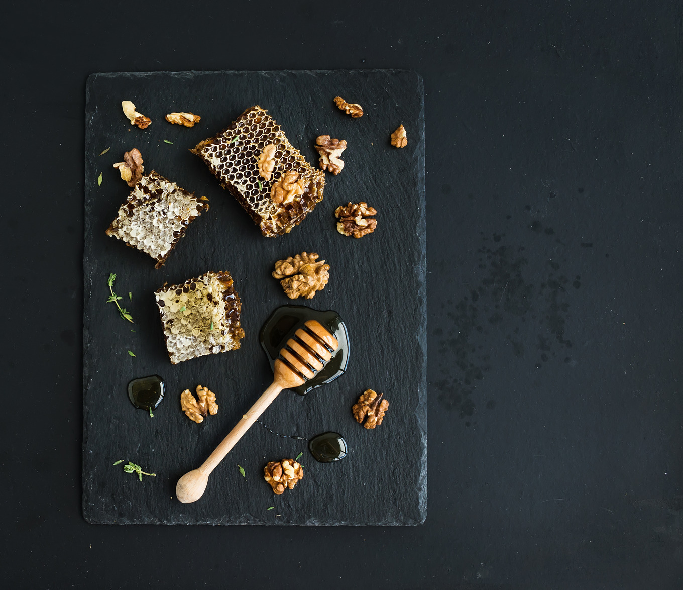 Honeycomb walnuts and honey dipper featuring honeycomb, stick, and ...