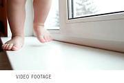 Baby legs. First steps. Slow motion., a Person Photo by Grey Coast Media