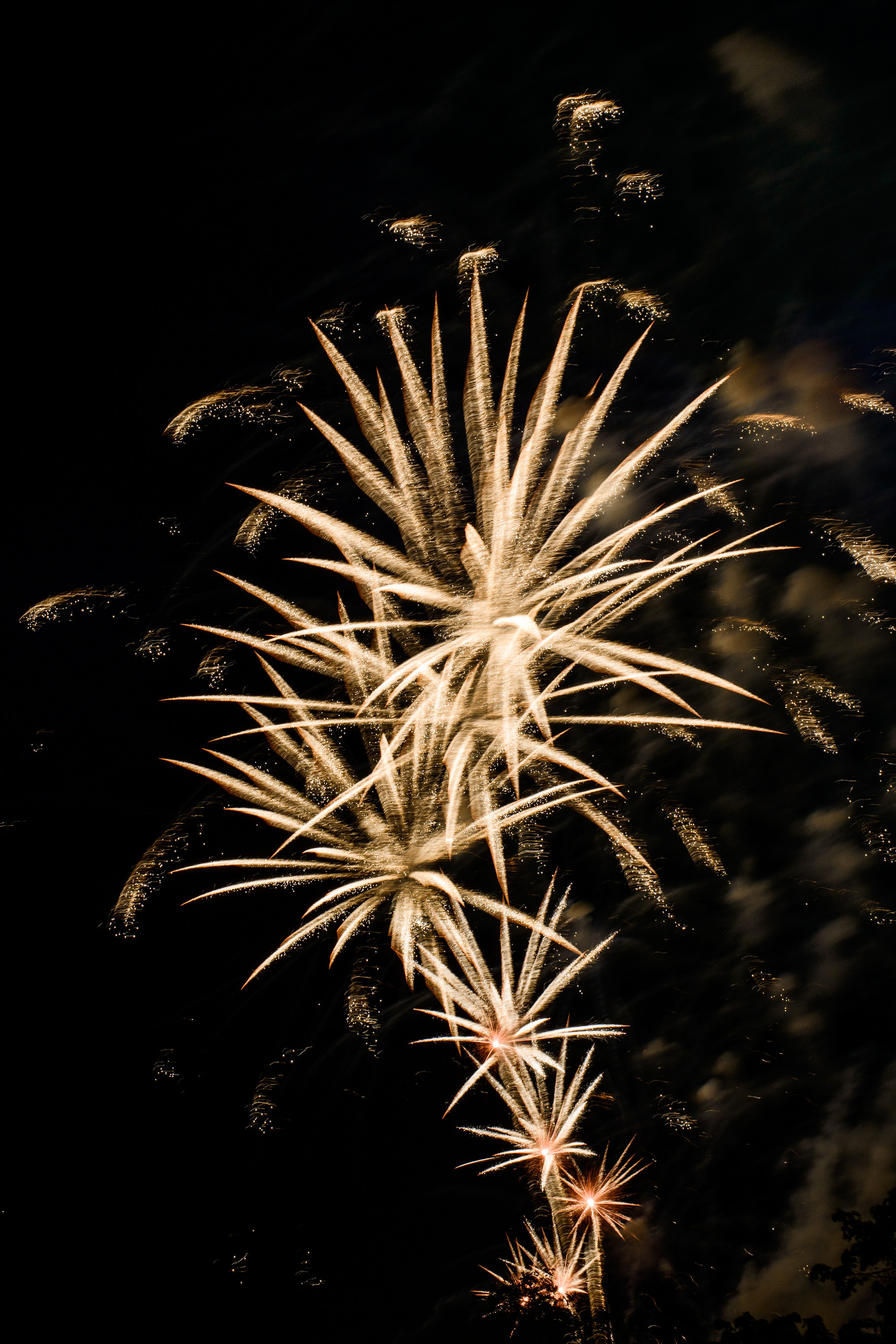 Burst of gold party fireworks, an Abstract Photo by olgakhazai