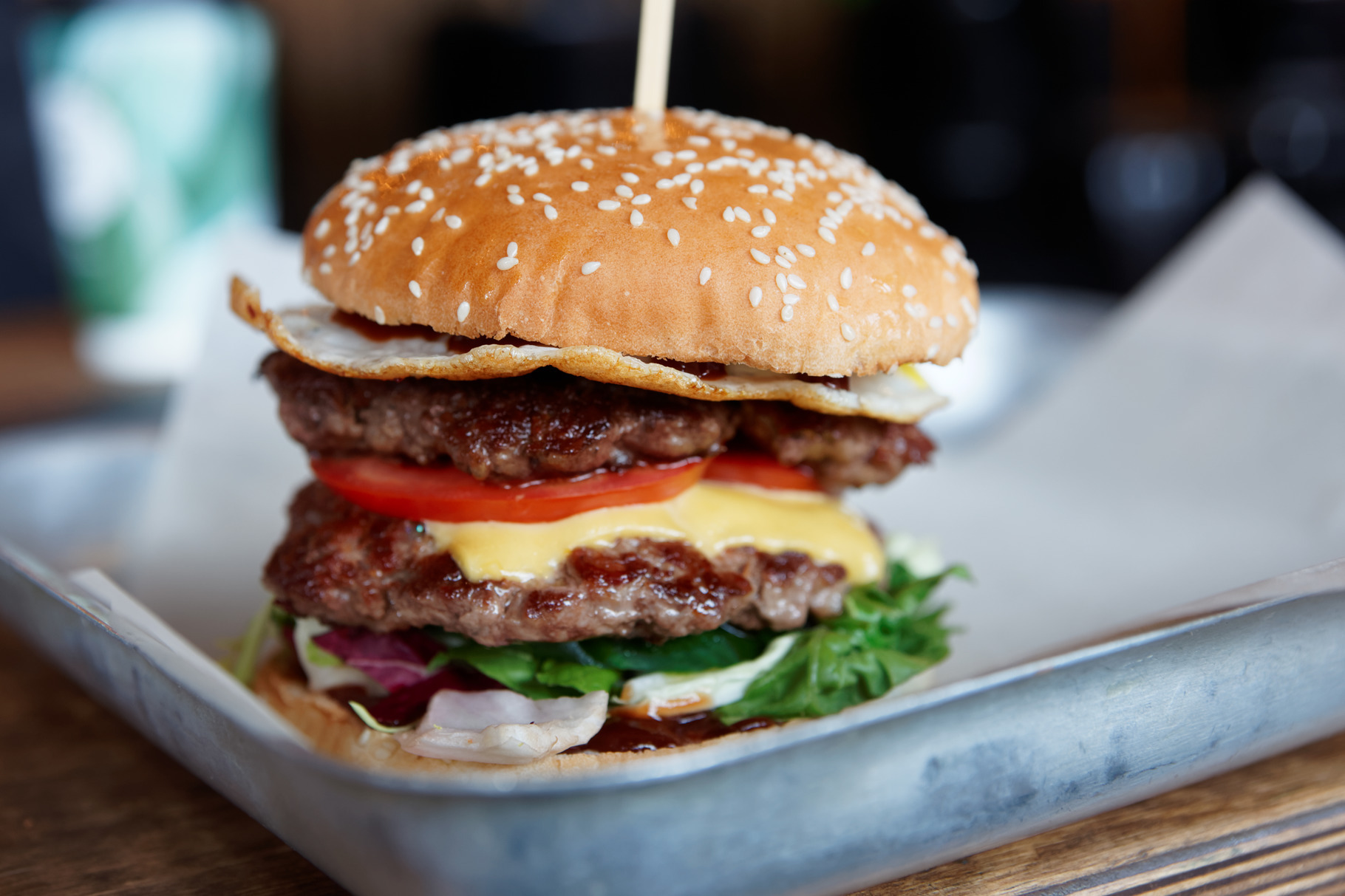 Big burger on restaurant table featuring american, international, and ...