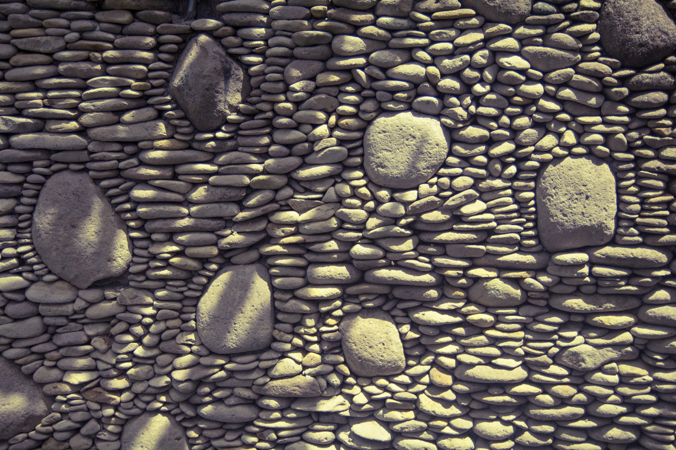 Sunlit Pebble Texture, an Abstract Photo by Karolis Masilionis