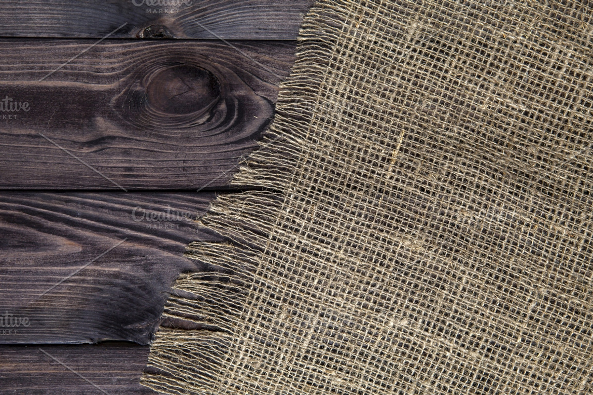 Rustic burlap on a wooden table, a Texture Graphic by Max Lashcheuski
