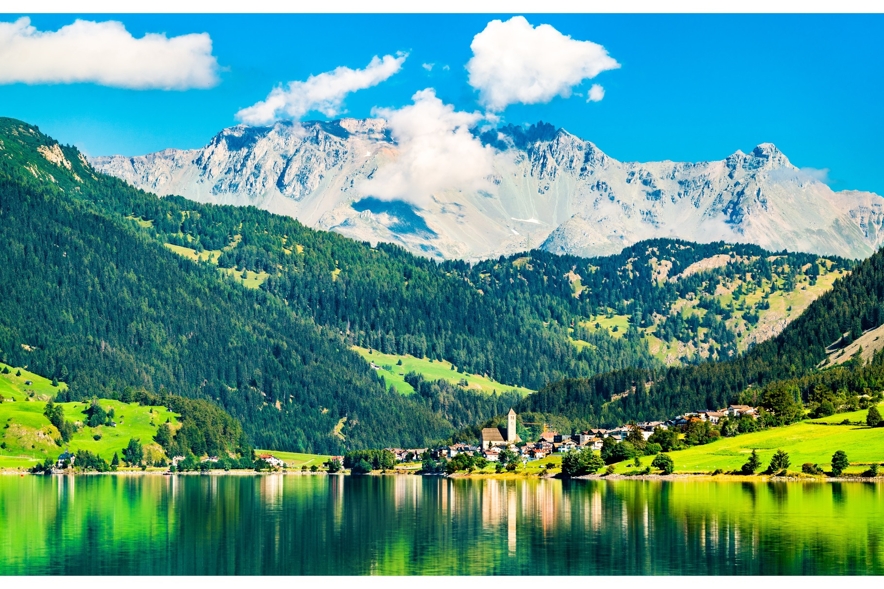 Reschen am see or resia a village featuring italy, alps, and town ...