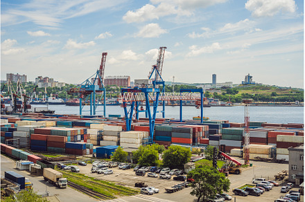 Aerial top view of container cargo s featuring warehouse, water, and ...