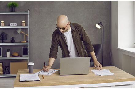 Man using his macbook pro featuring macbook, laptop, and office, a ...