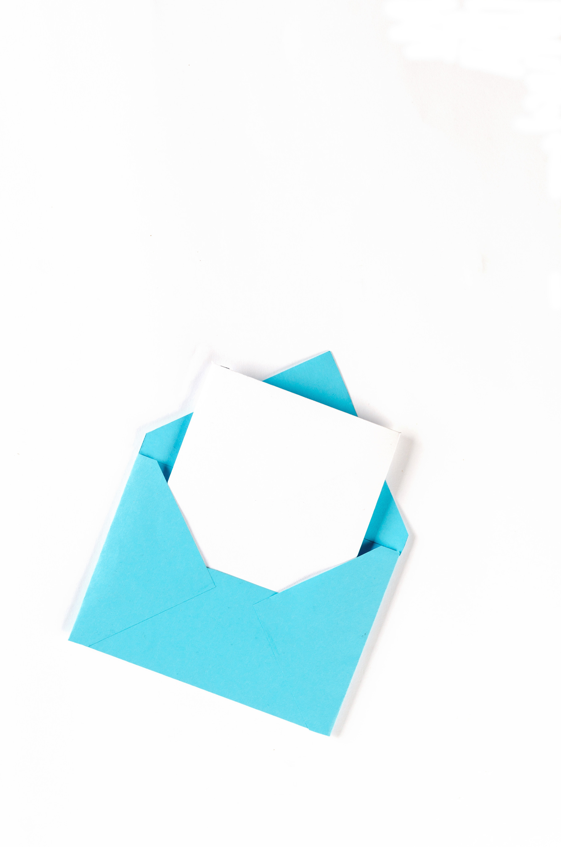 open blue envelope with paper sheet, a Background Photo by vimart