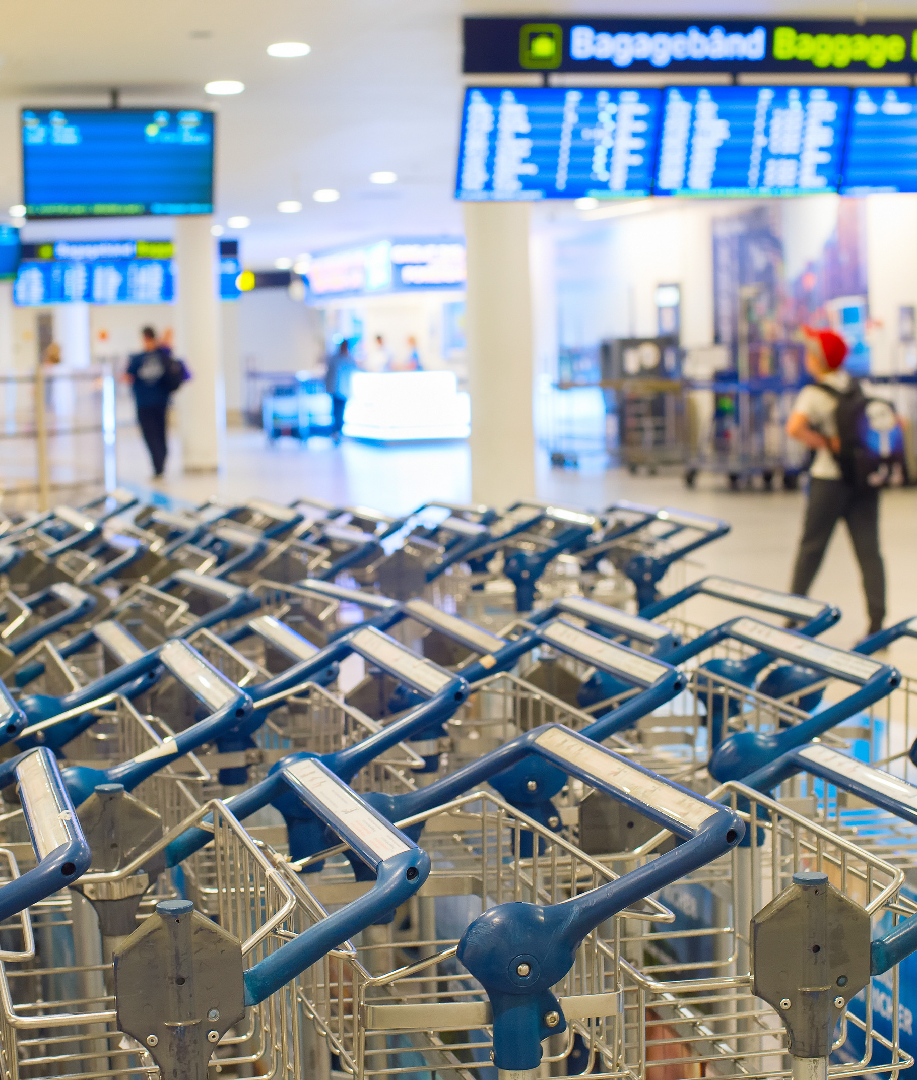 Baggage trolleys at airport terminal featuring airport, trolley, and, a ...