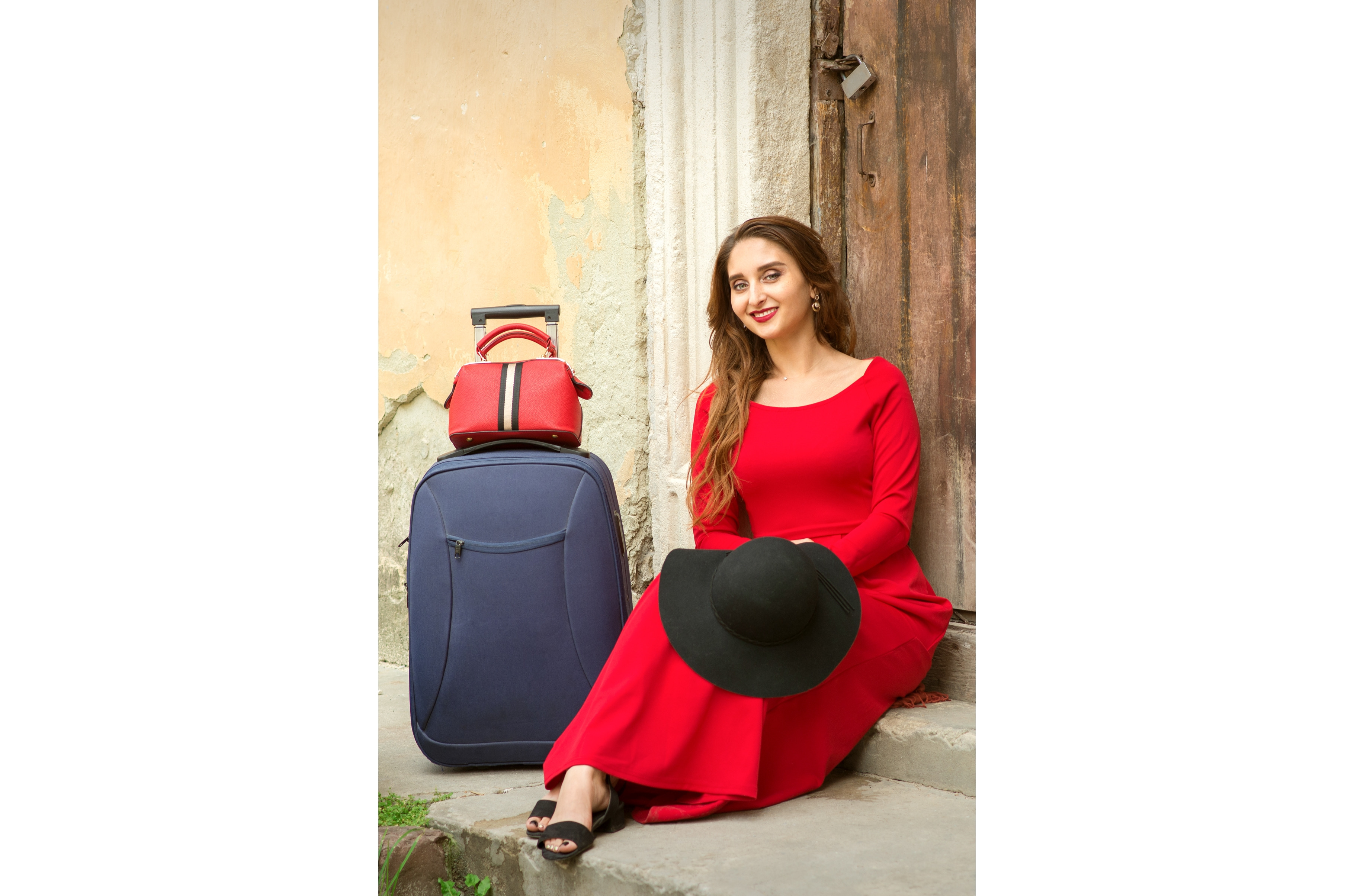 Woman sitting on threshold house, a Person Photo by okskukuruza