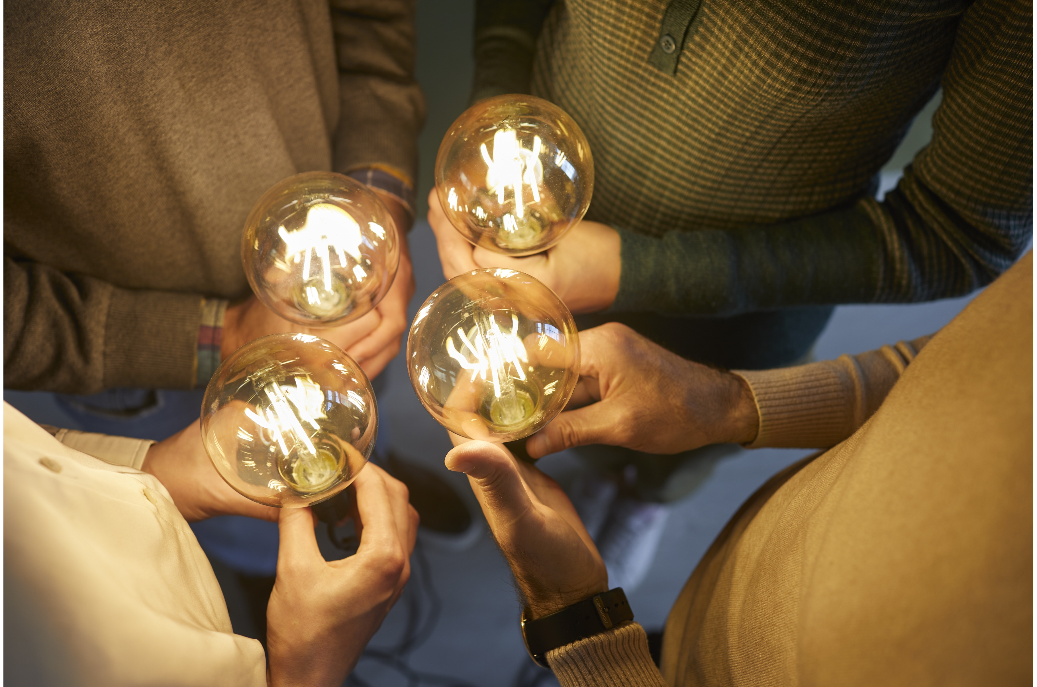 Team of people holding bright light, a Business Photo by StudioRomantic ...
