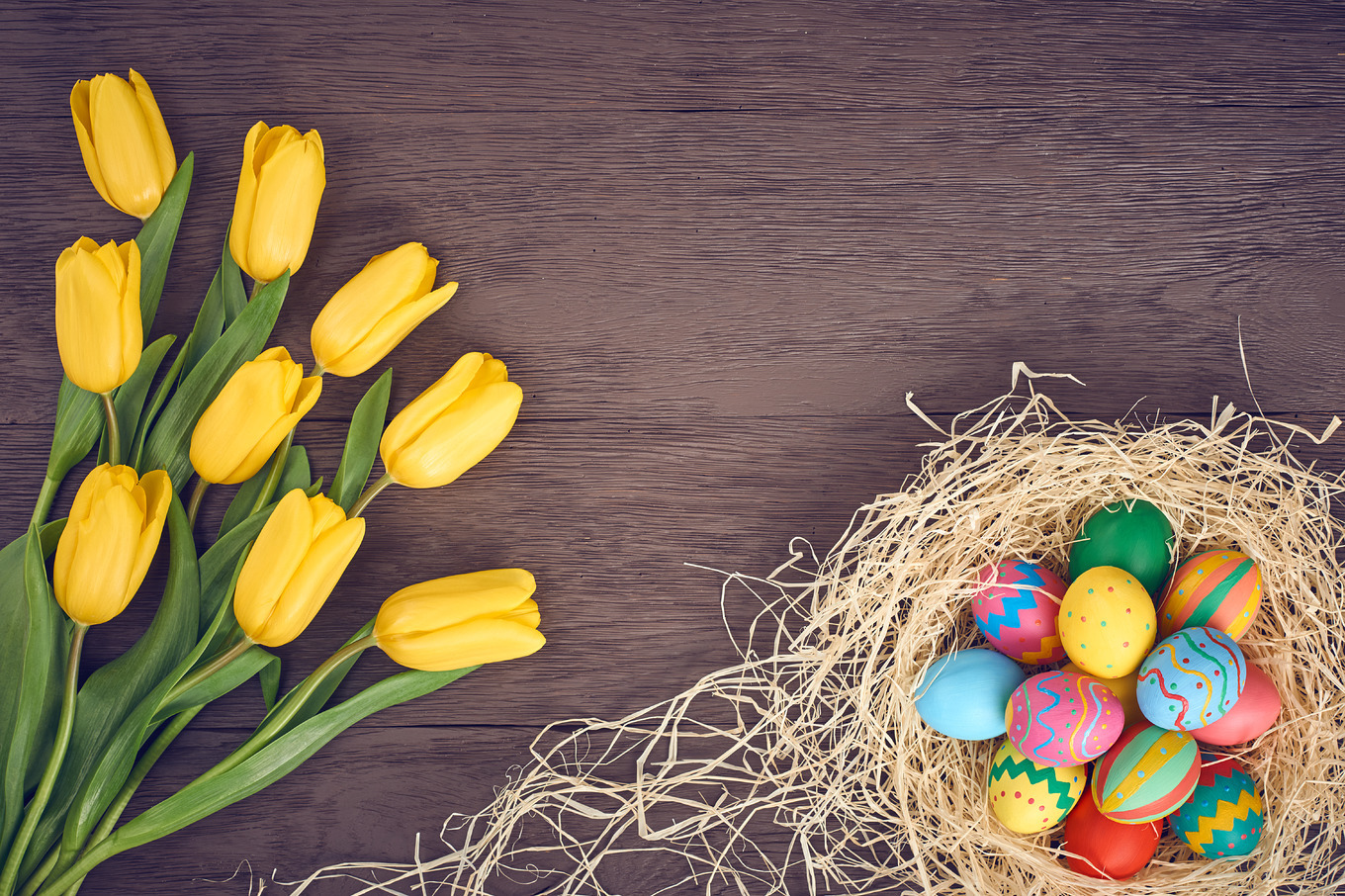 Easter background eggs yellow tulips on wood featuring easter ...