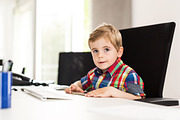 Little boy working in office featuring computer, people, and business ...