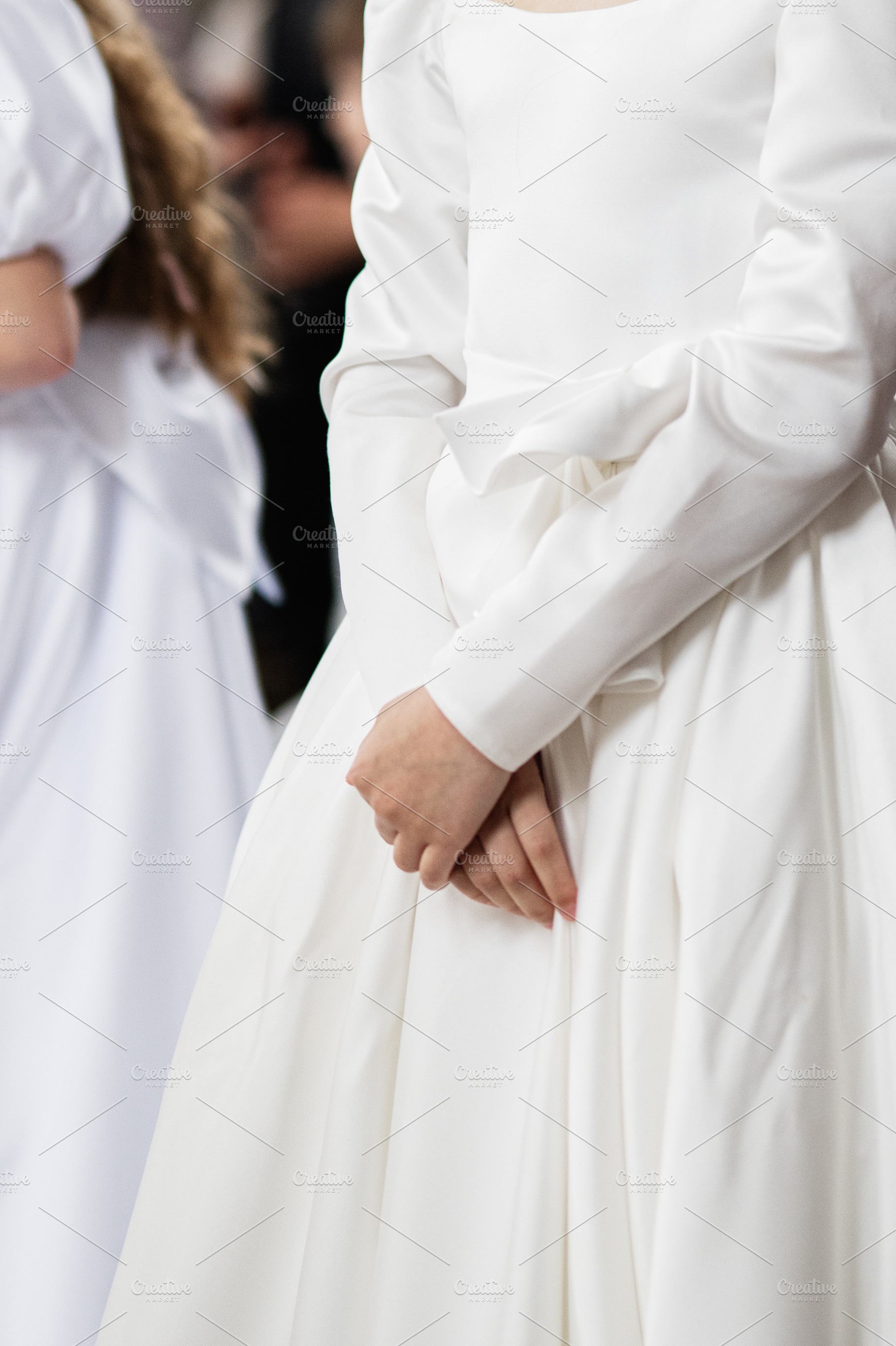 First holy communion ceremony with children in elegant white attire, a ...