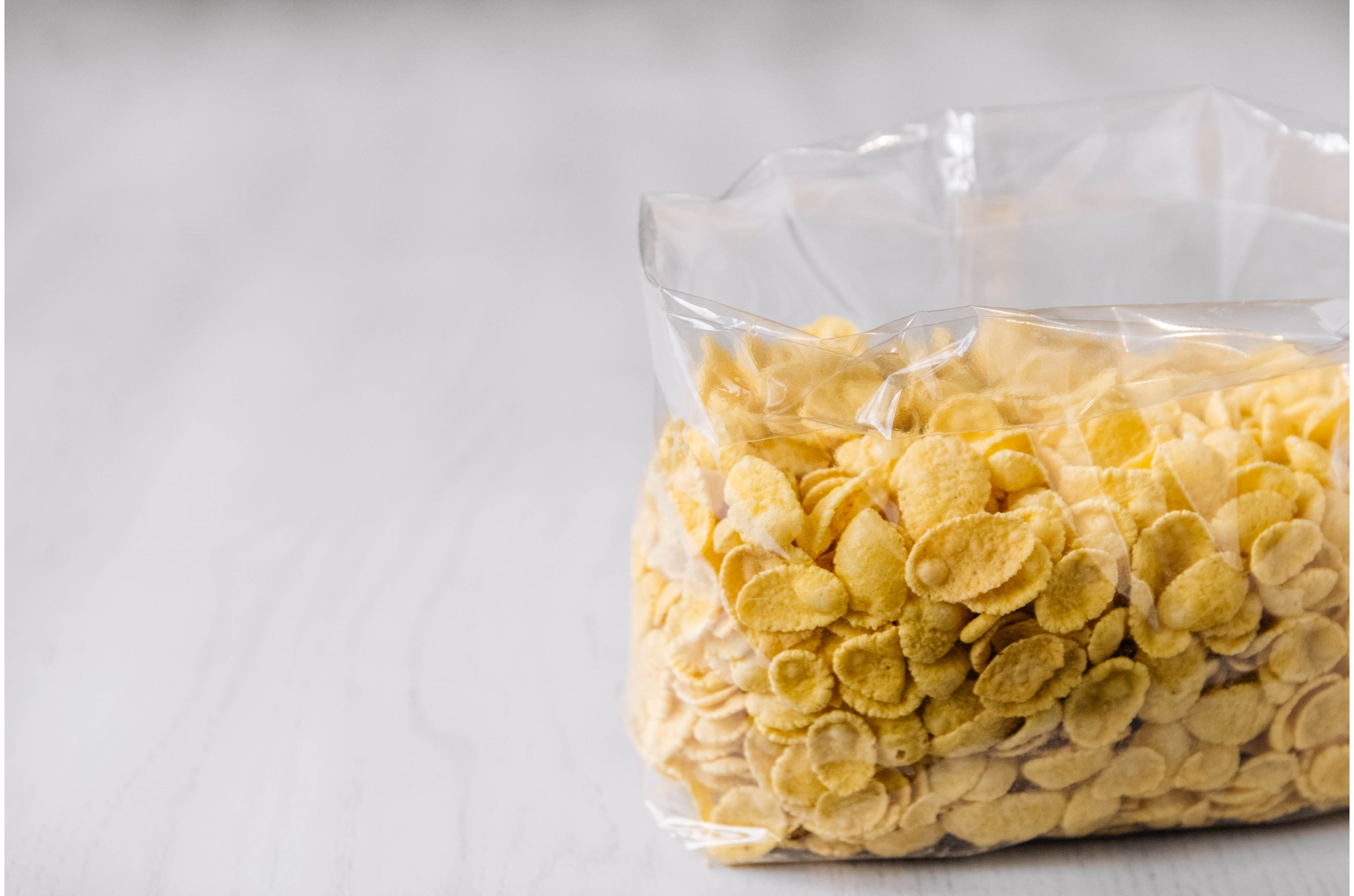 Cornflakes in plastic bag on white, a Food & Drink Photo by olhovyi ...