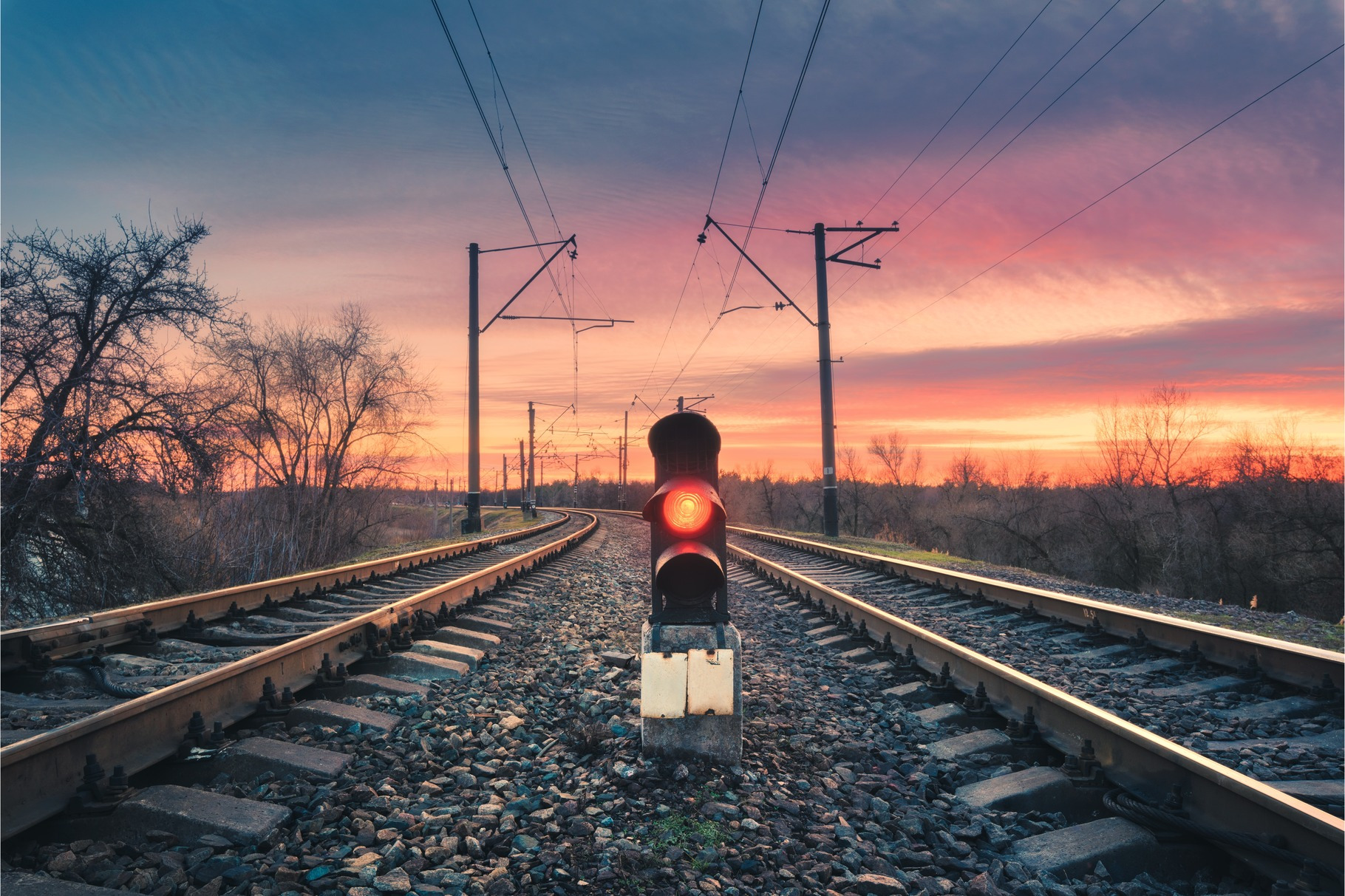 Railway station with traffic light at sunset featuring rail, railroad ...