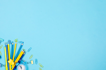 Blue and yellow school stationery on blue background., a School ...