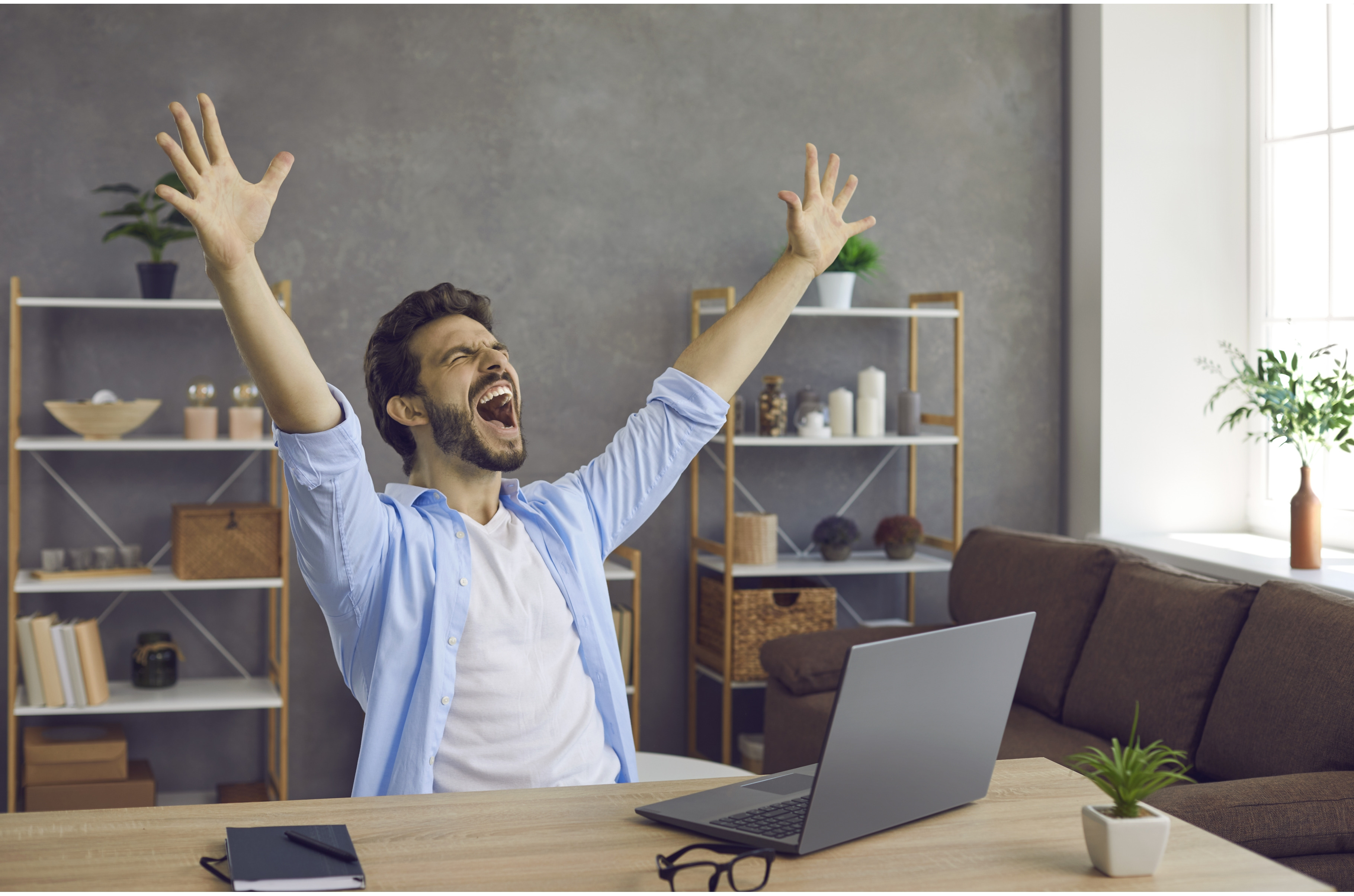 Happy excited young man screaming, a Person Photo by StudioRomantic