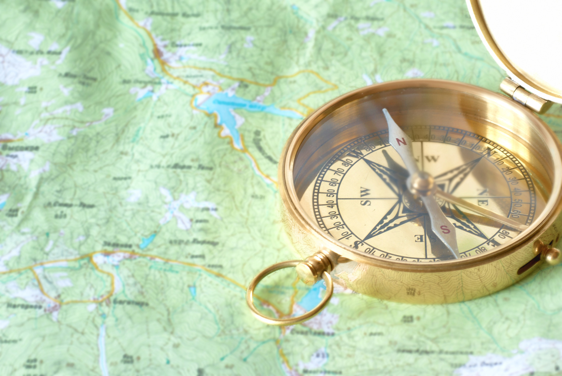 Ancient golden compass on the map, a Business Photo by Vapi
