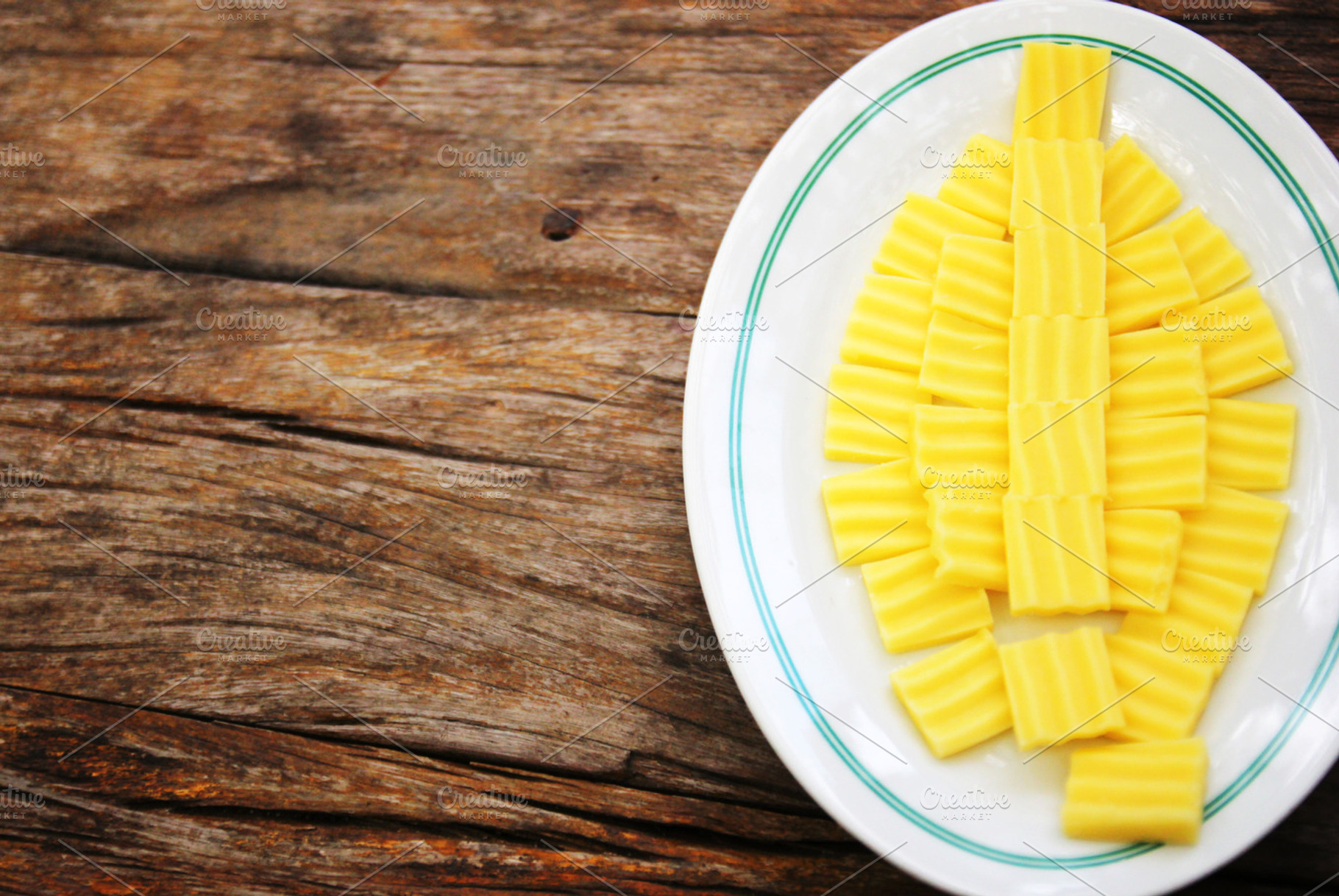 Top view of sliced Cheese on dish, a Photo by Nuchylee Photo | Creative ...