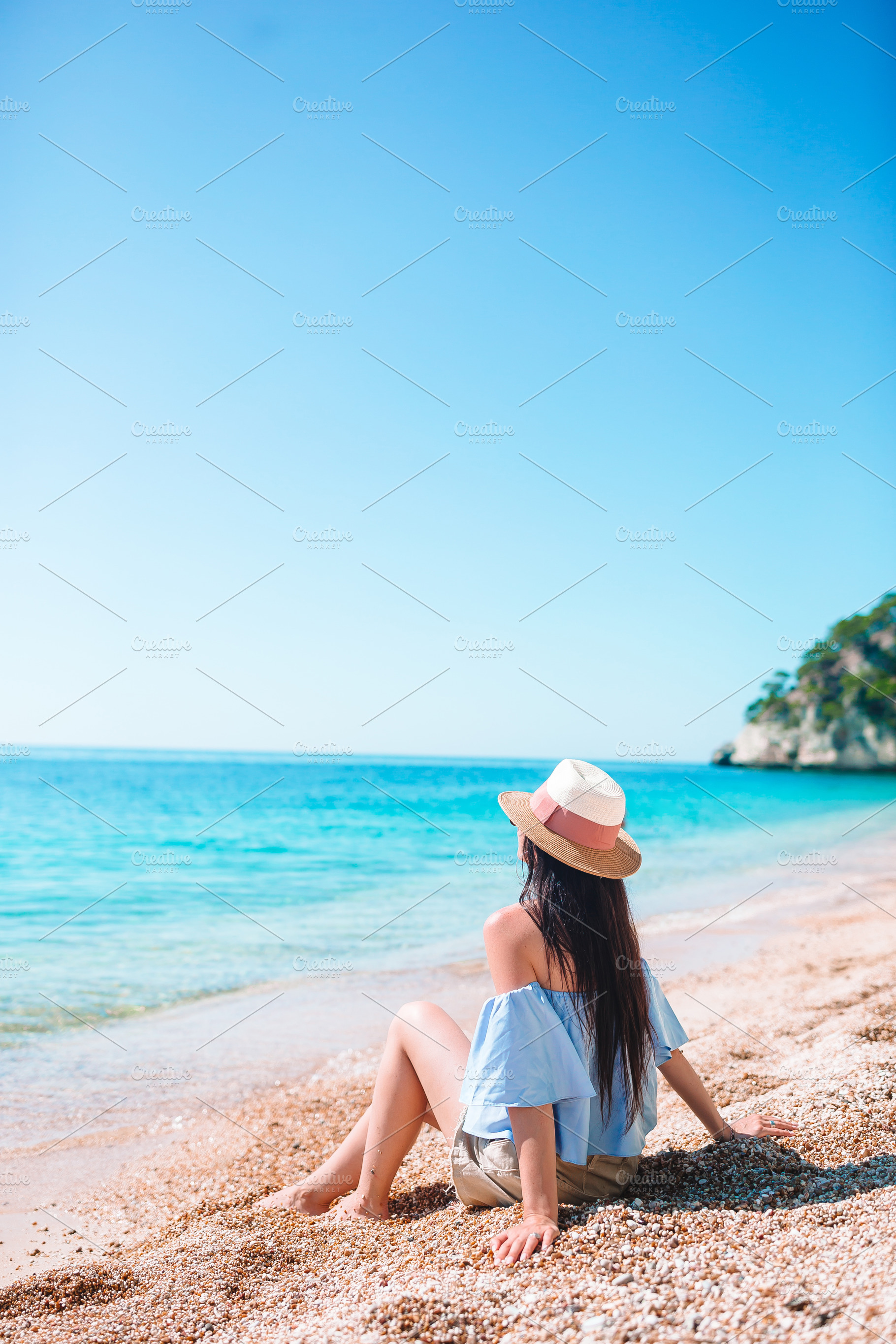 Woman laying on the beach enjoying s stock photo containing beach and ...