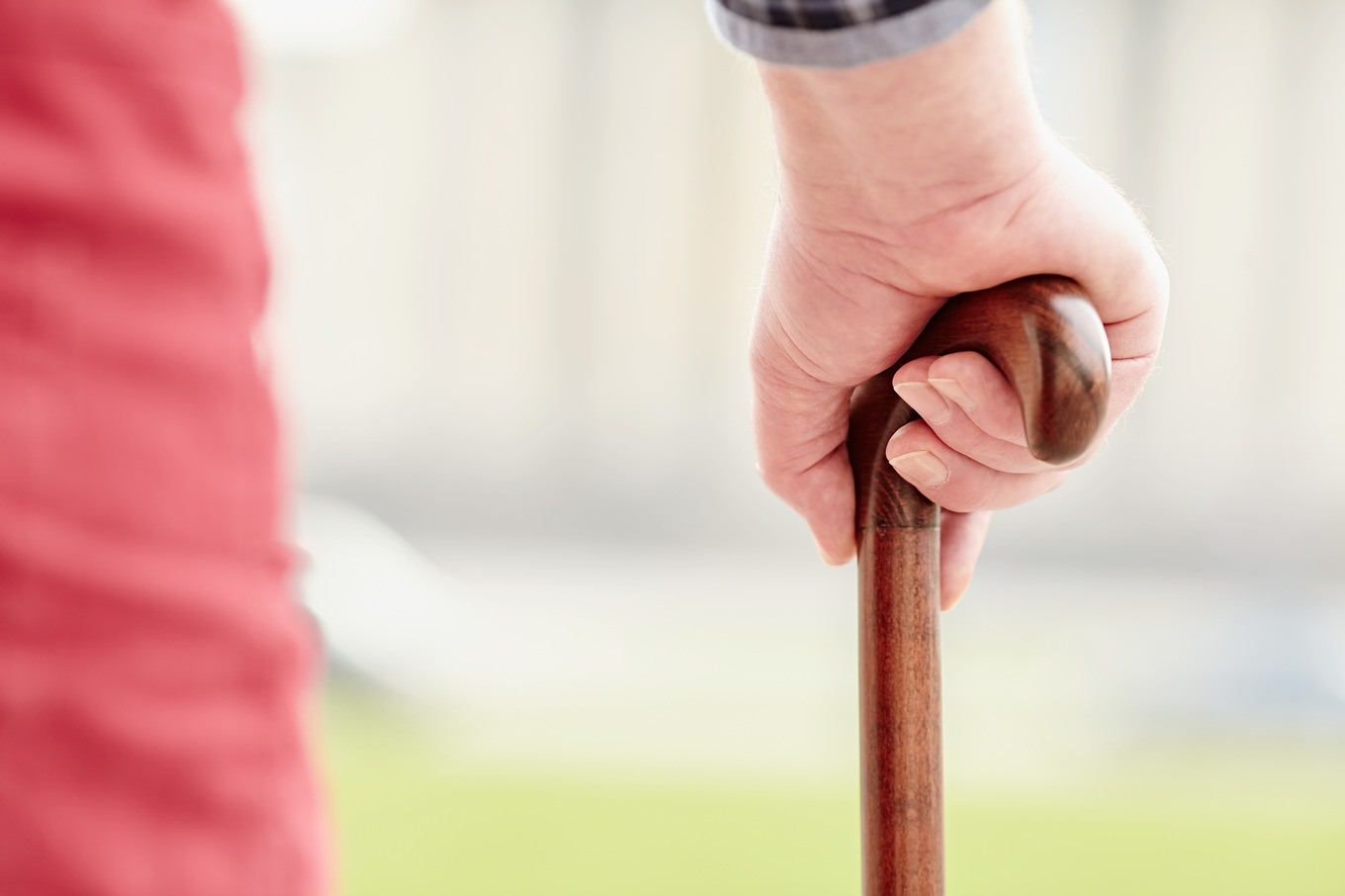 Hand with cane closeup featuring aged, arthritis, and assistance, a ...